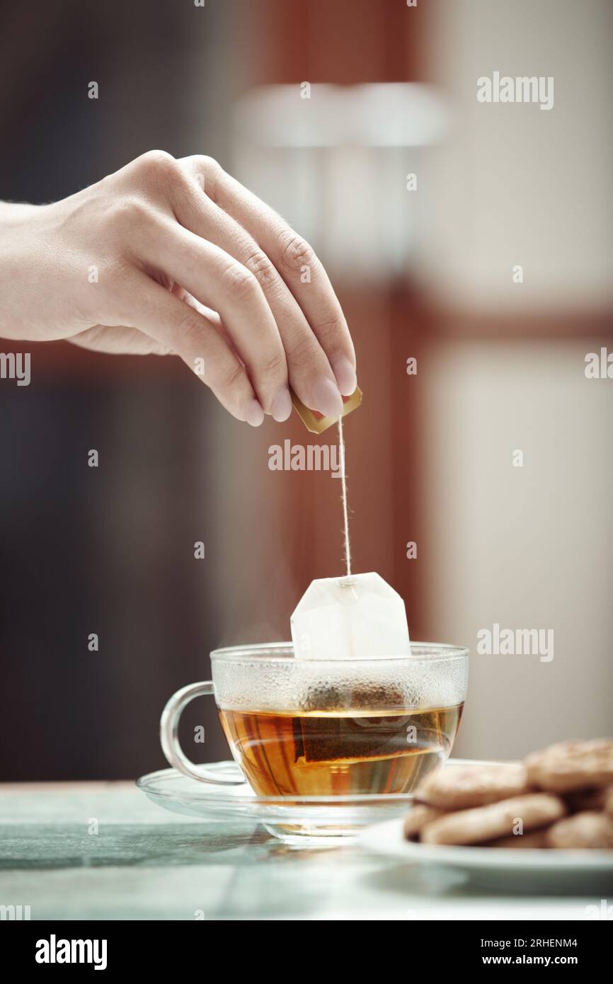 Woman hand teabag hi-res stock photography and images - Alamy