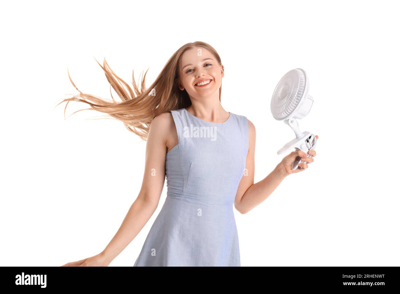 Young woman with electric fan on white background Stock Photo - Alamy