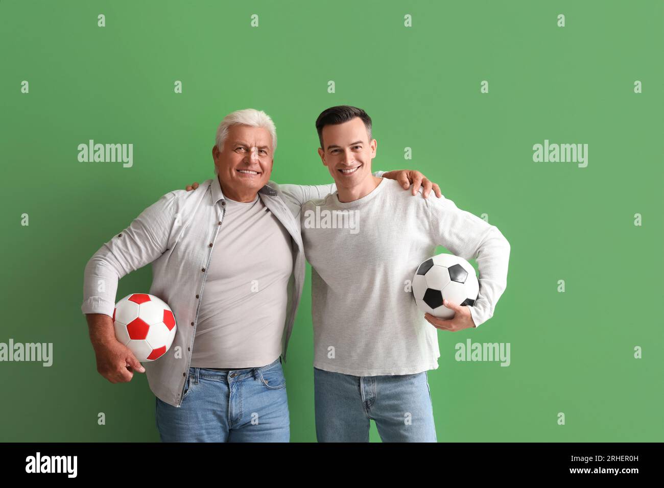 Father football hugging son hi-res stock photography and images - Alamy