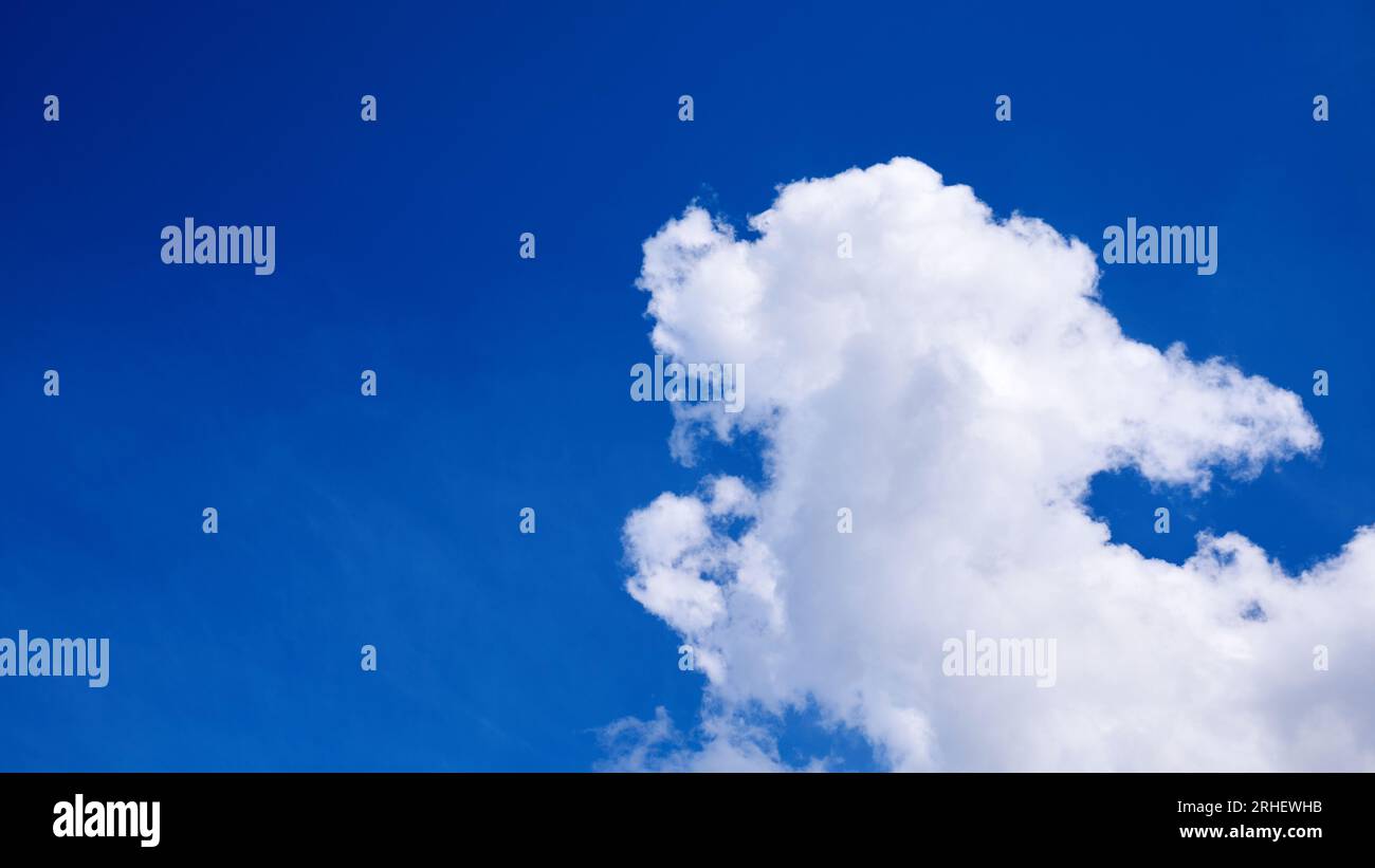 Widescreen blue sky background with white cloud Stock Photo - Alamy