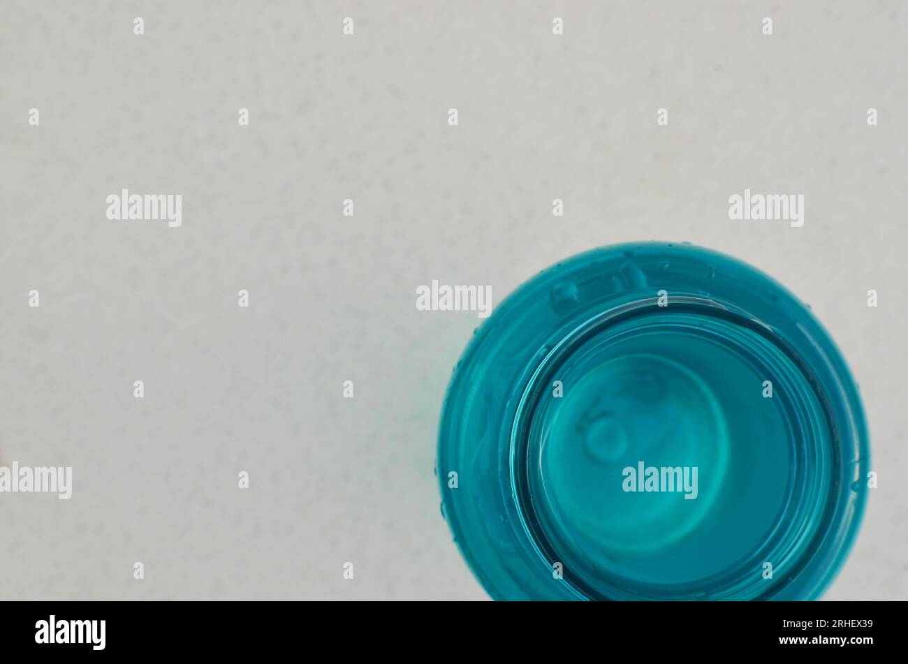 Detail of a bottle of blue water, the essence of hydration for ...
