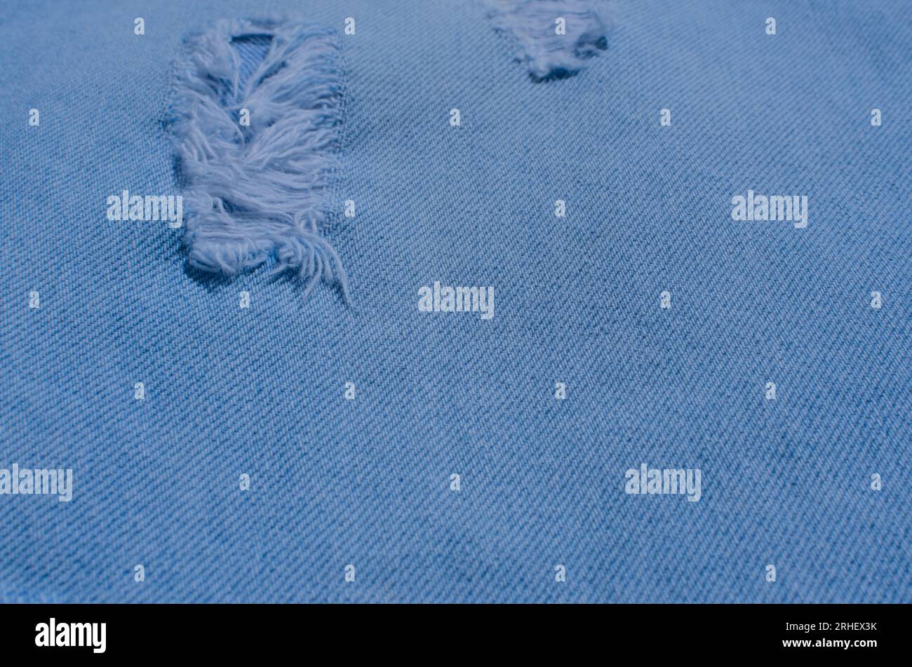 Close-up of a denim texture in detail, revealing the intertwined lines ...