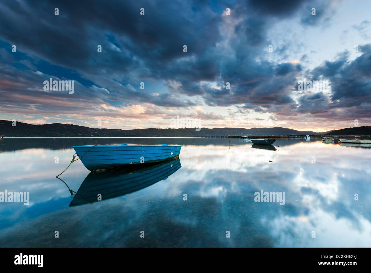 Landcape scenery photograph of row boats on lagoon estuary in Knysna ...