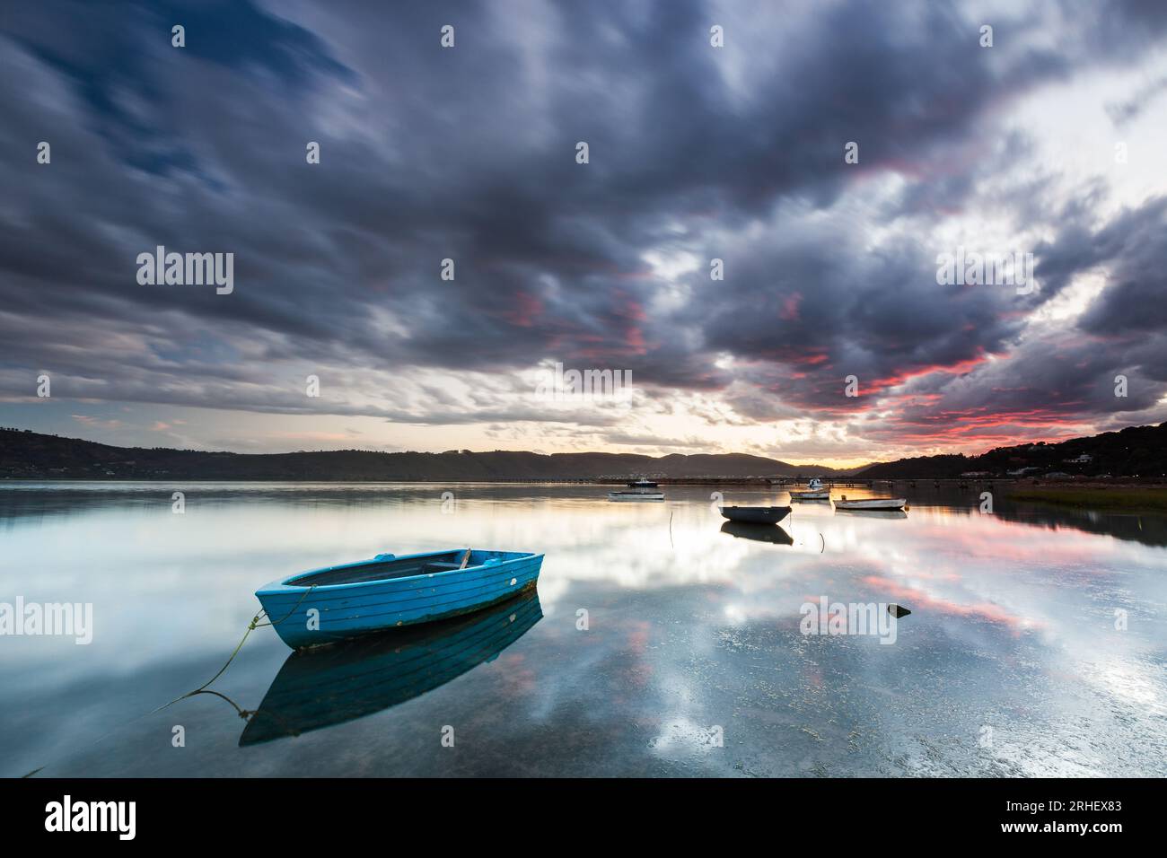 Landcape scenery photograph of row boats on lagoon estuary in Knysna ...