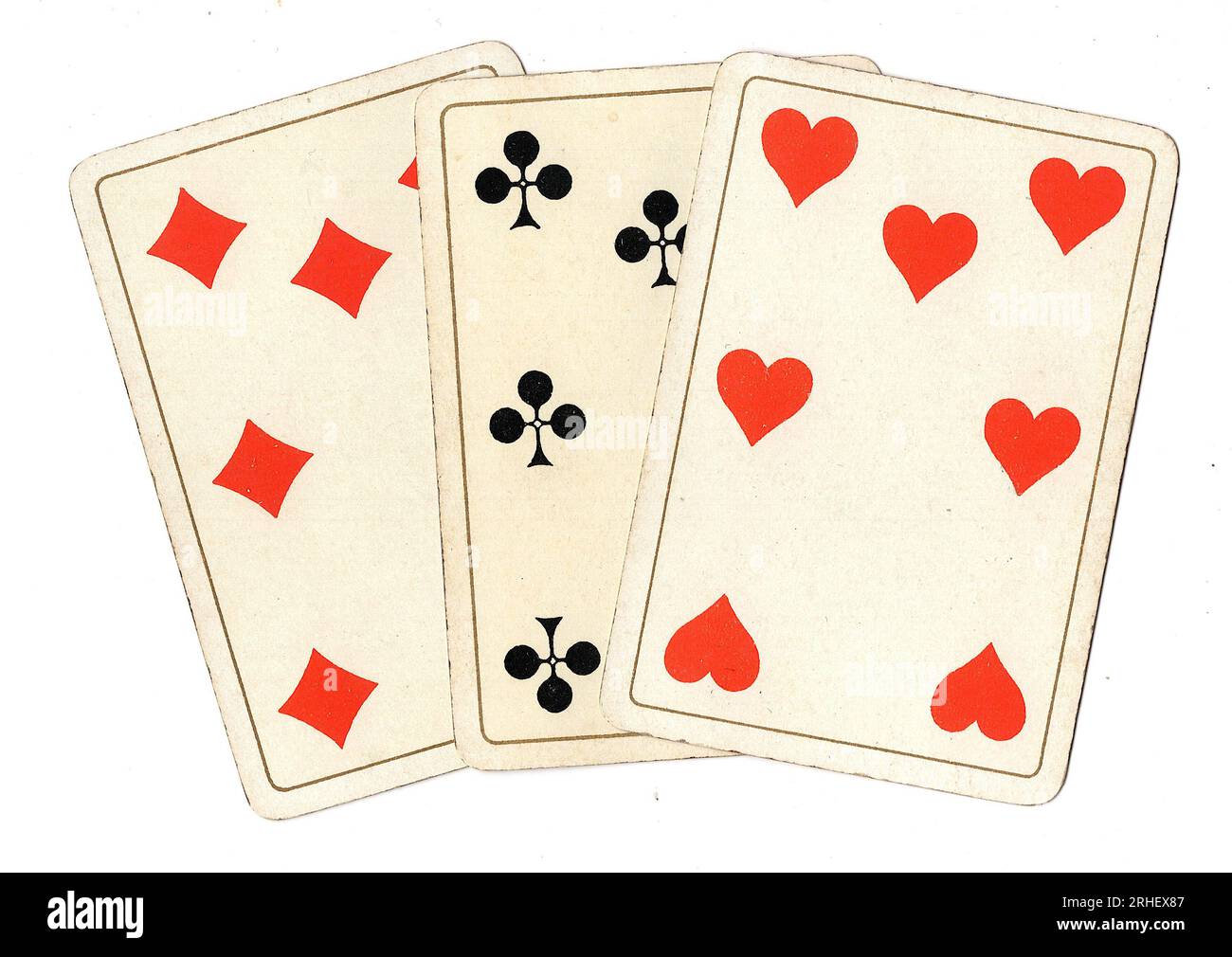 Antique playing cards featuring three sevens on a white background ...