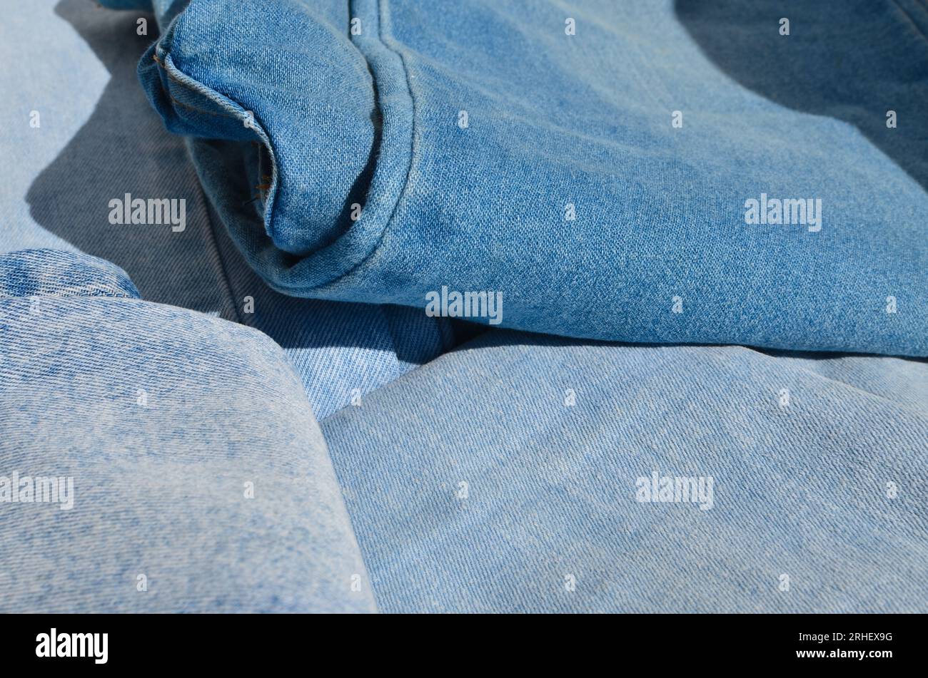 Close-up of jeans fabric texture with distinct lines and sewing pattern ...