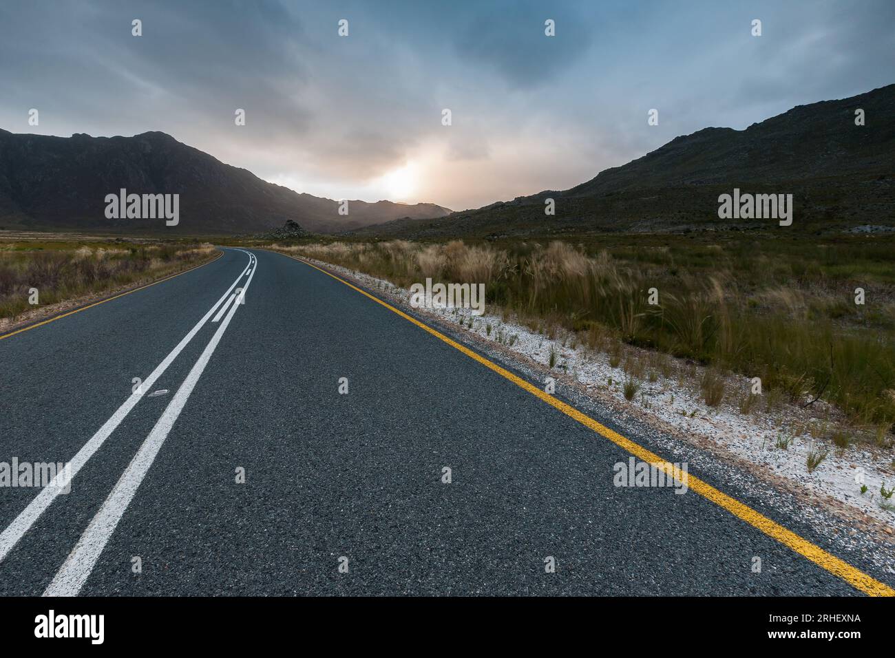 Country asphalt tar road with white and yellow line markings in rural ...