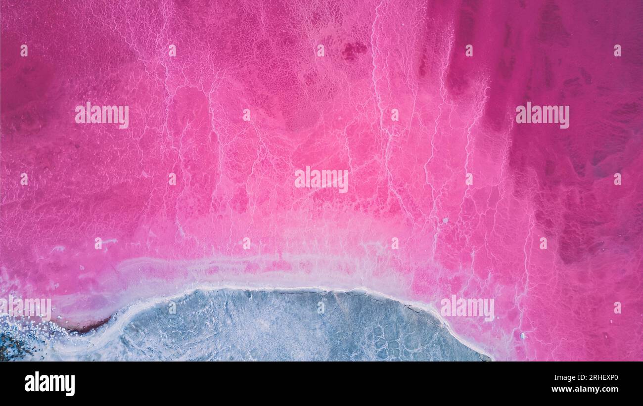 Aerial view of pink salt lake. Salt production plants evaporated brine ...