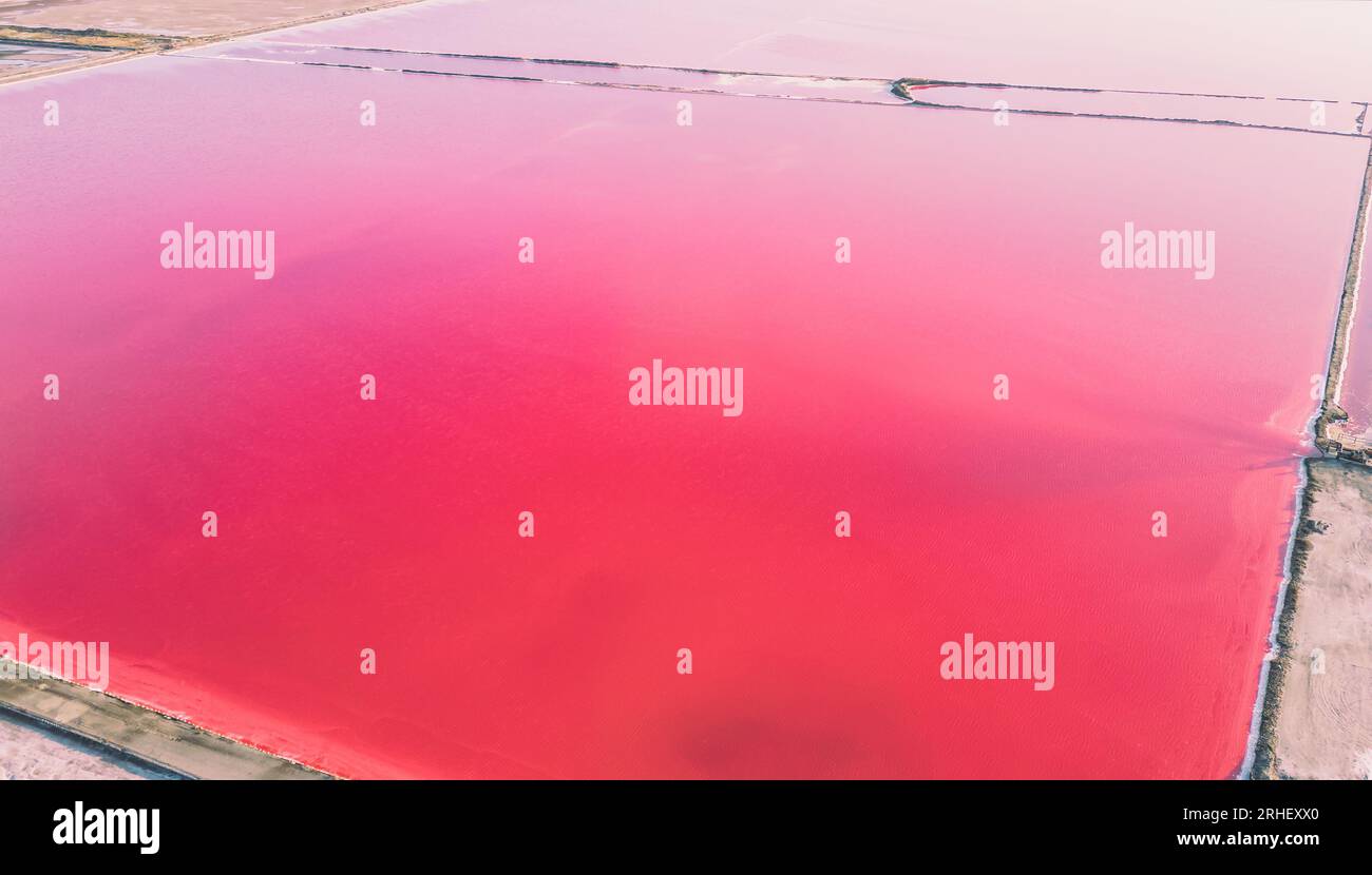 Aerial view of pink salt lake. Salt production plants evaporated brine ...