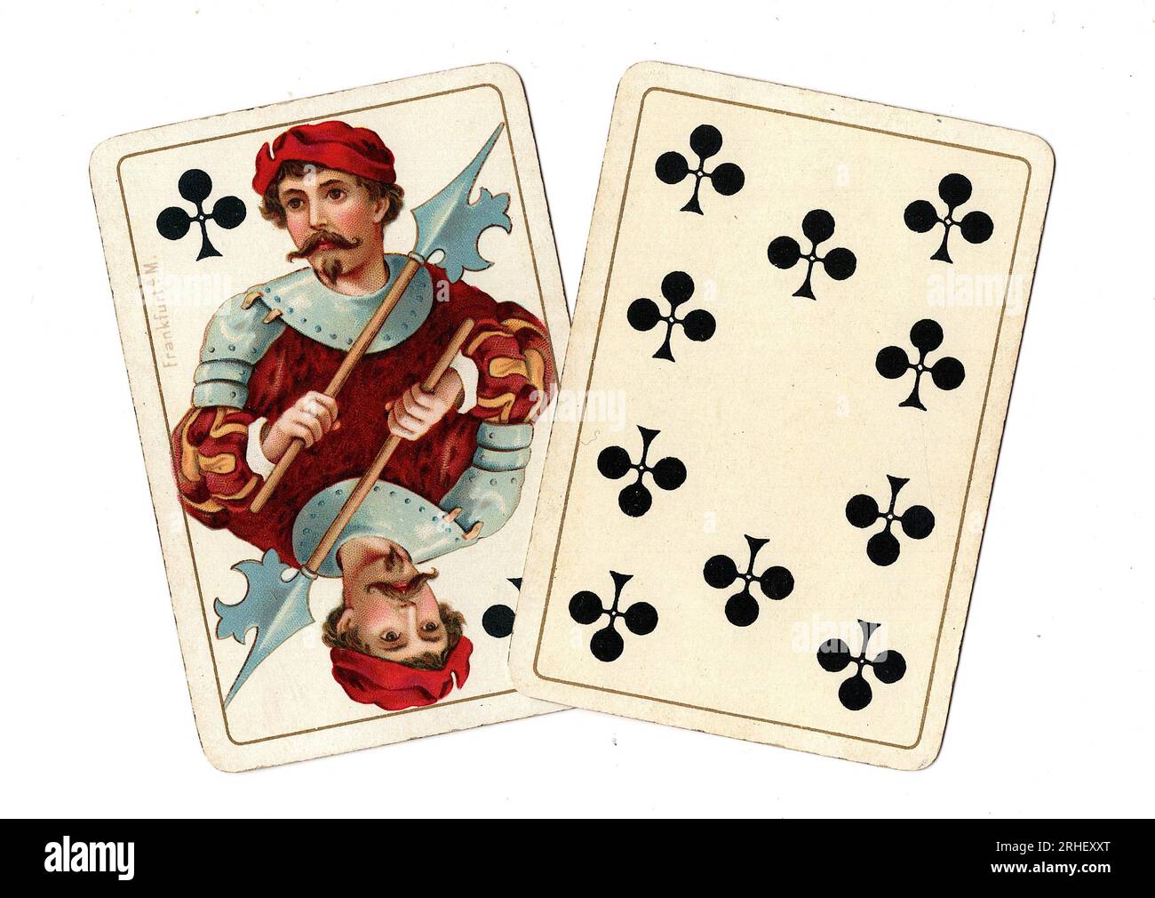 A pair of antique playing cards showing a jack and ten of clubs on a ...