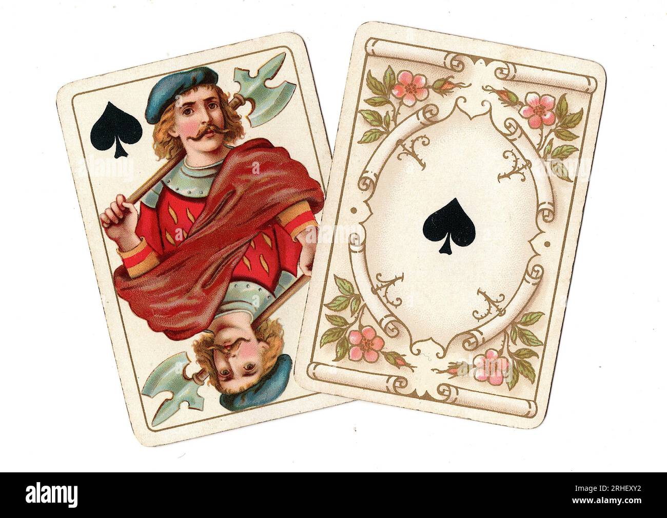 A pair of antique playing cards showing an ace and jack of spades on a ...