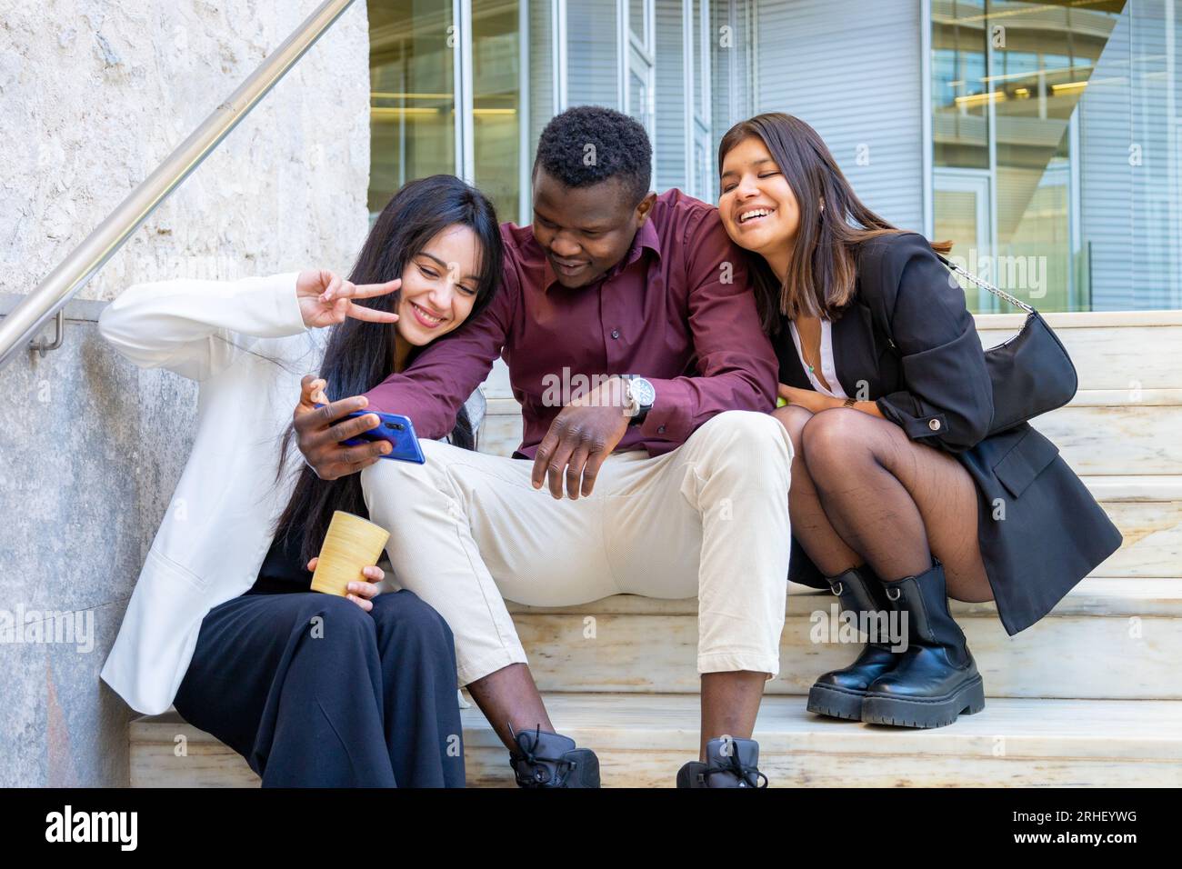 Happy coworkers taking a selfie photo at work break. Group of young ...