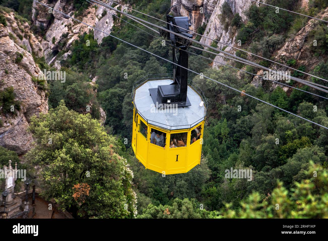 The yellow cabin on the Aeri de Montserrat, a cable car that takes ...