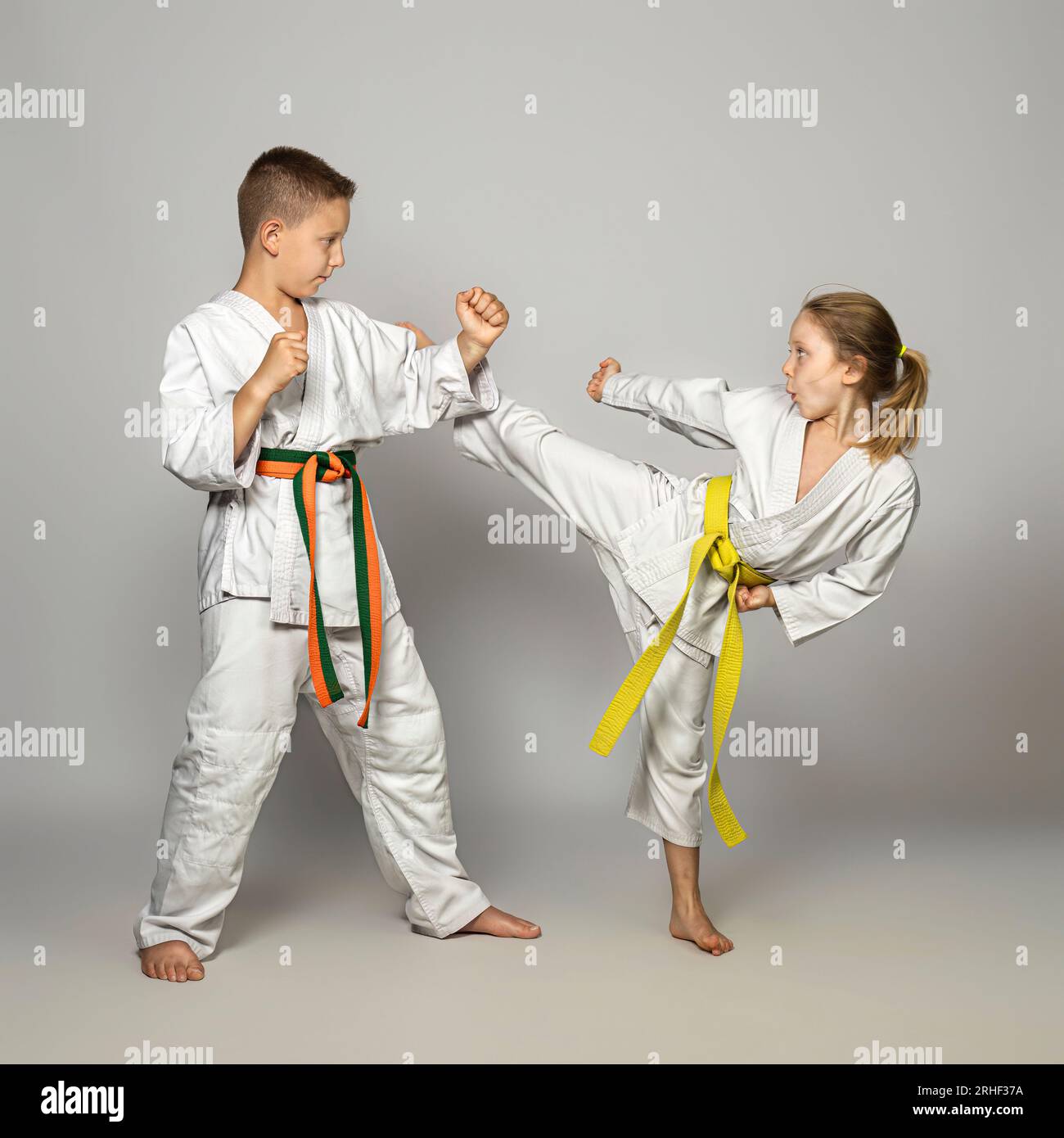 kids practise martial arts, studio shot Stock Photo - Alamy
