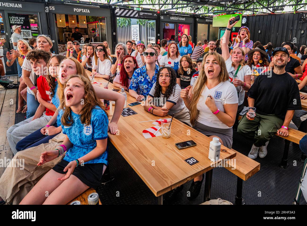 London, UK. 16th Aug, 2023. Tense moments - Fans in the Boxpark ...
