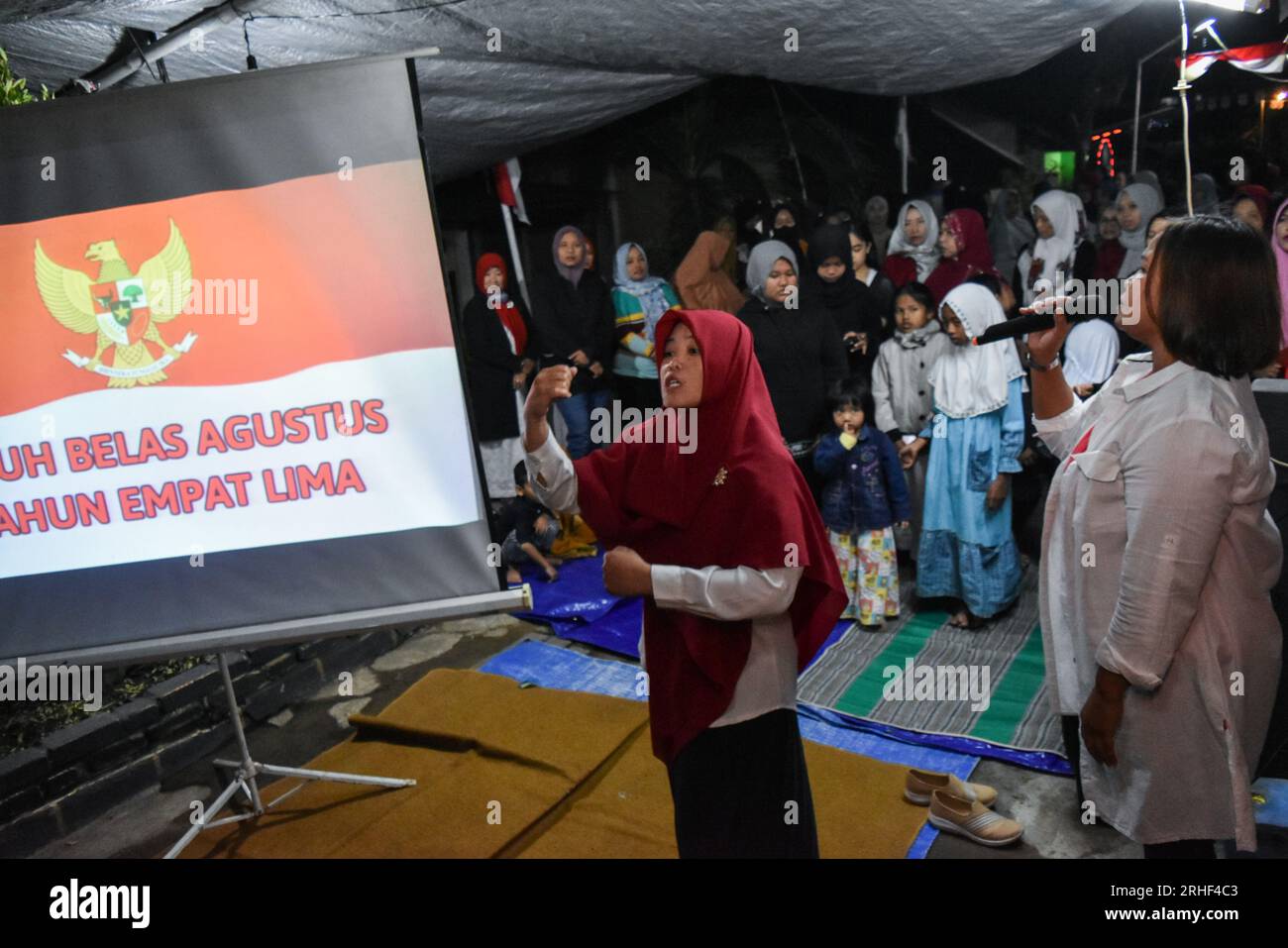 Malang, East Java, Indonesia. 16th Aug, 2023. residents are sing the national anthem before the ...