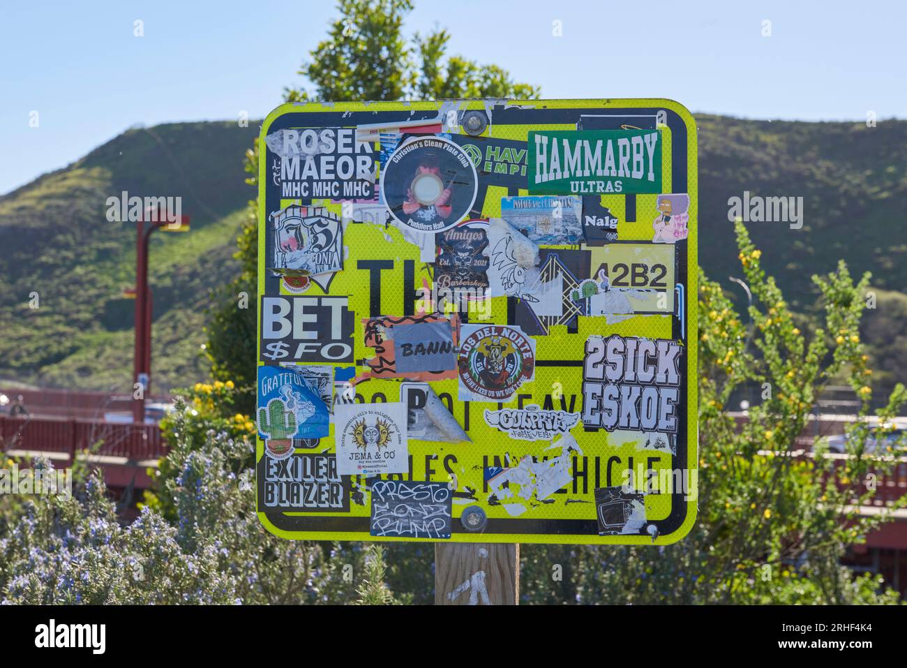 street sign with sticker icons covering it Stock Photo - Alamy