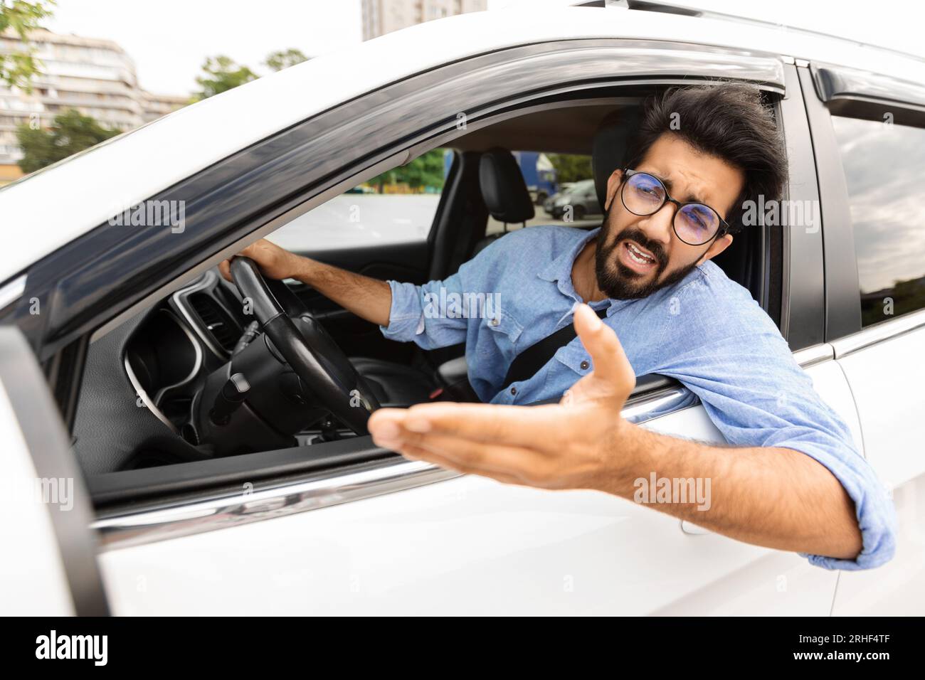 Angry driver stuck in traffic jam gesturing with hand, screaming Stock ...