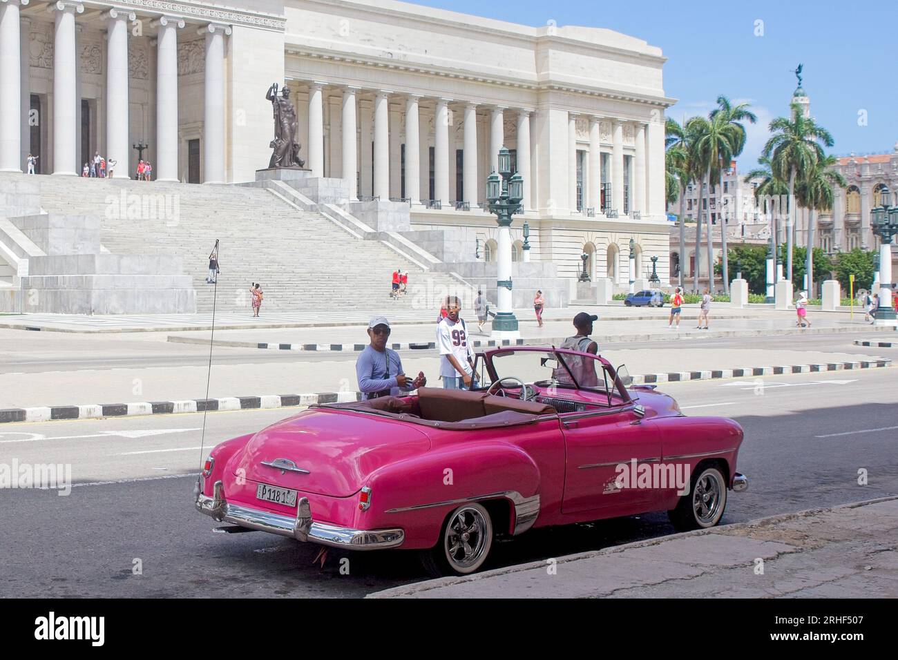 Havana, Cuba, a vintage convertible American car is parked by the ...