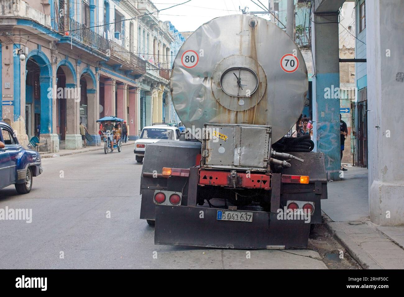 Havana, Cuba, a truck with a storage tank in the rear part is parked by ...