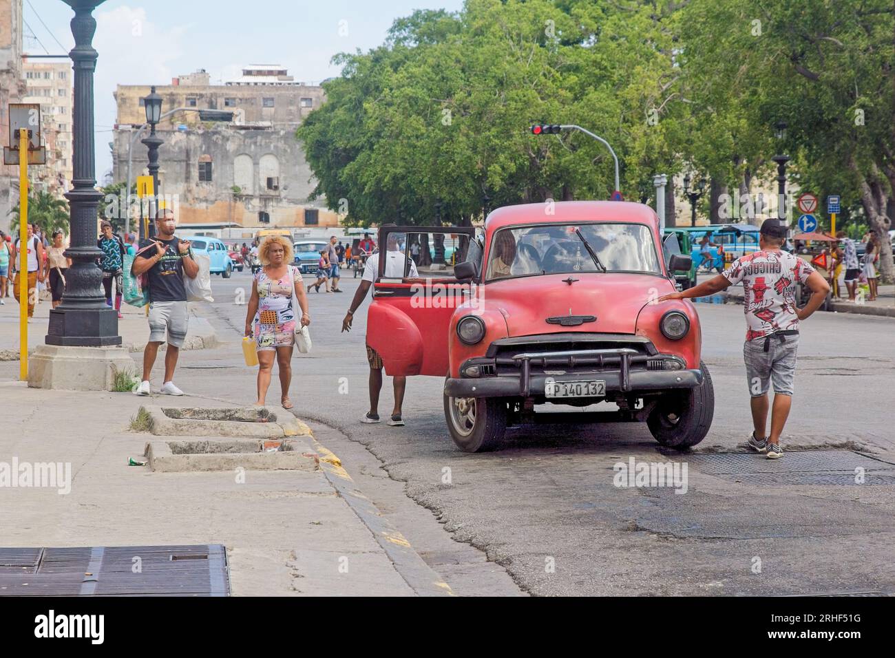 Havana, Cuba, a vintage American car with the open doors waits for ...