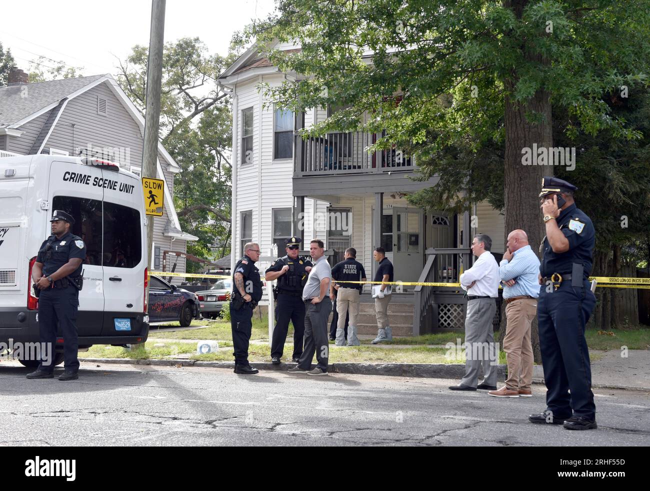 Springfield and state police confer at the scene of a shooting with ...