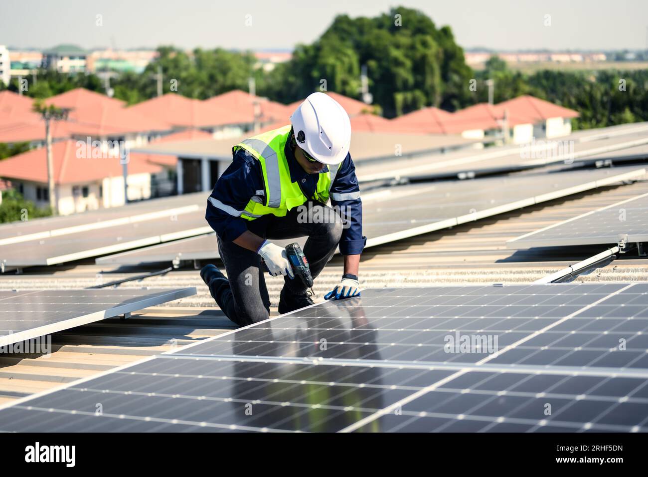 Engineers with safety helmet checking solar system at solar power farm ...