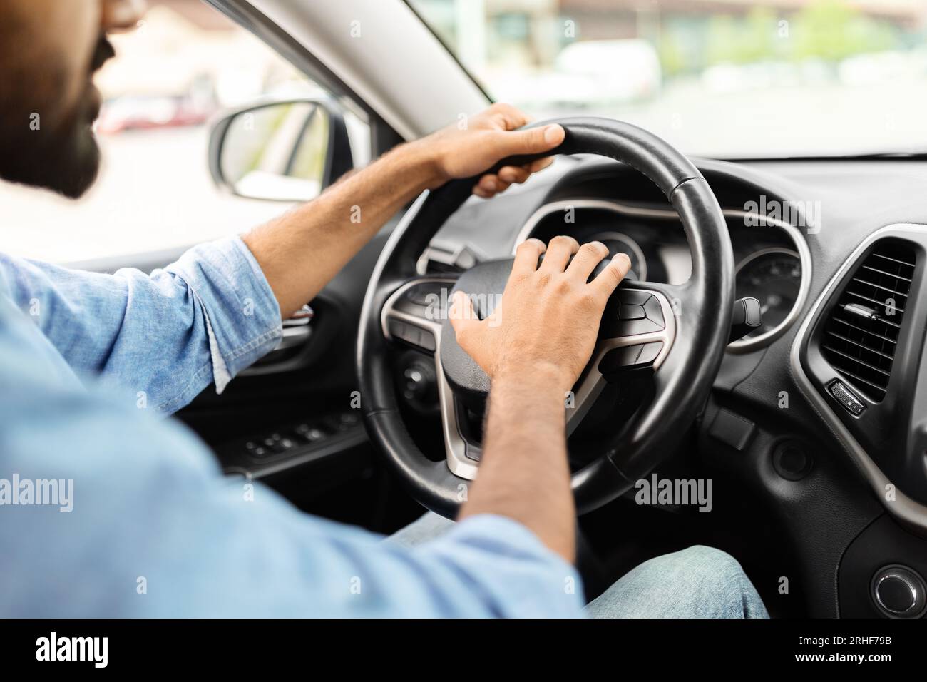 Cropped shot of middle eastern man honking while driving car Stock ...