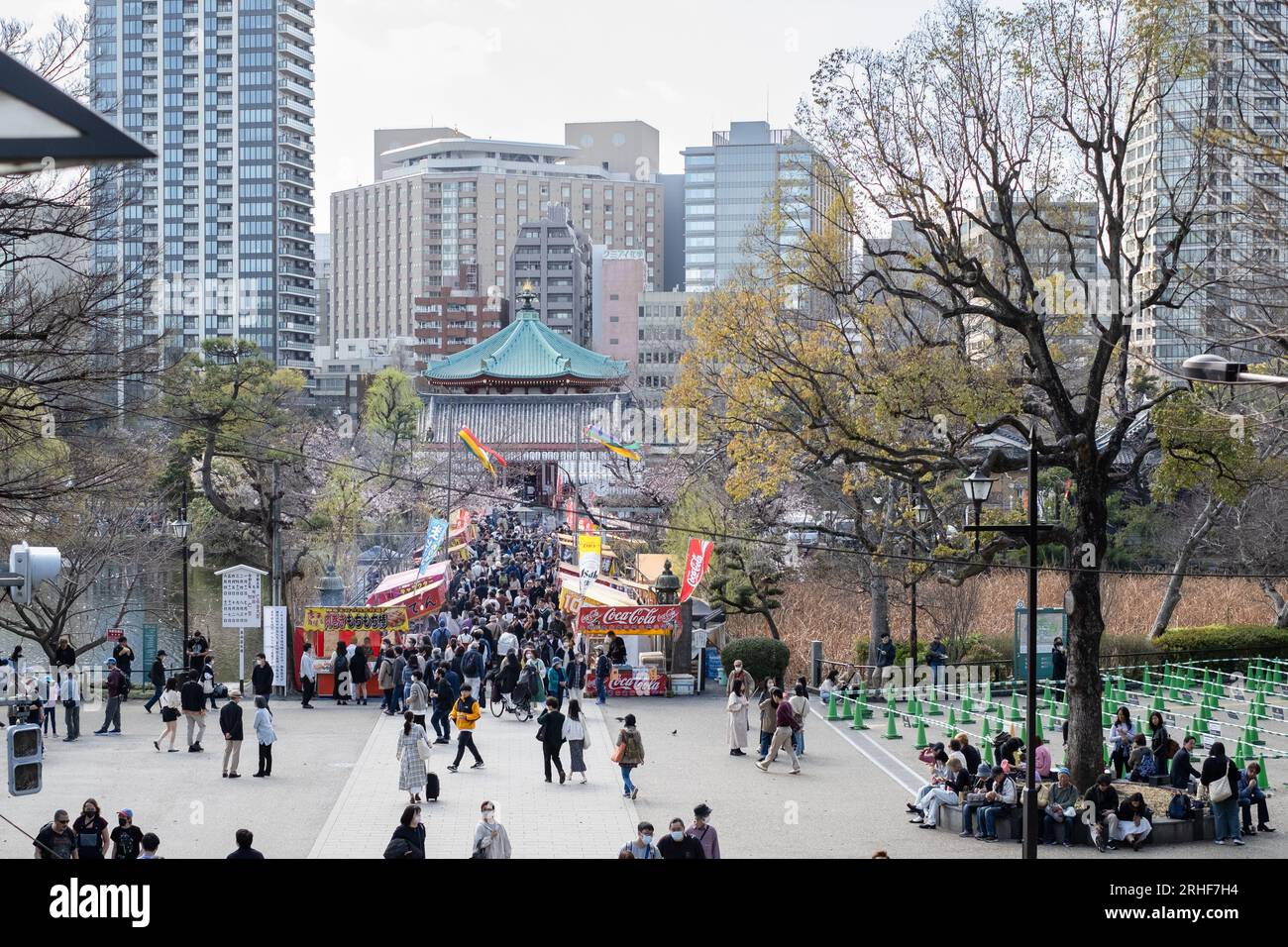 View towards Gojoten-jinja Shrine, with tourists at food stalls in front, Ueno Park, Ueno, Tokyo ...