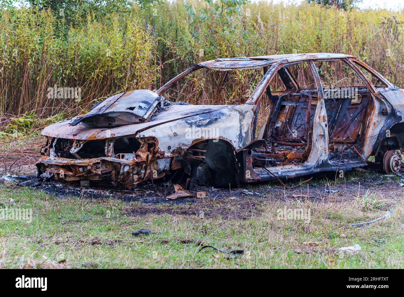 A burnt-out car. Car old burned by fire. Fire burned car Stock Photo ...