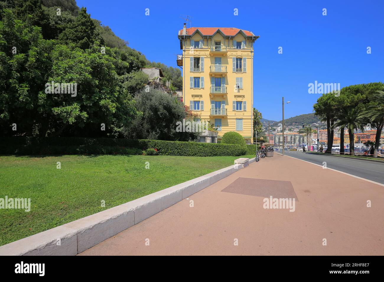 Yellow historic building on the street in Nice Stock Photo - Alamy
