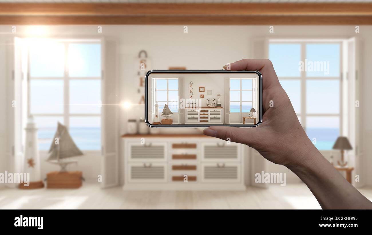 Hand holding smart phone, AR application, simulate furniture and ...