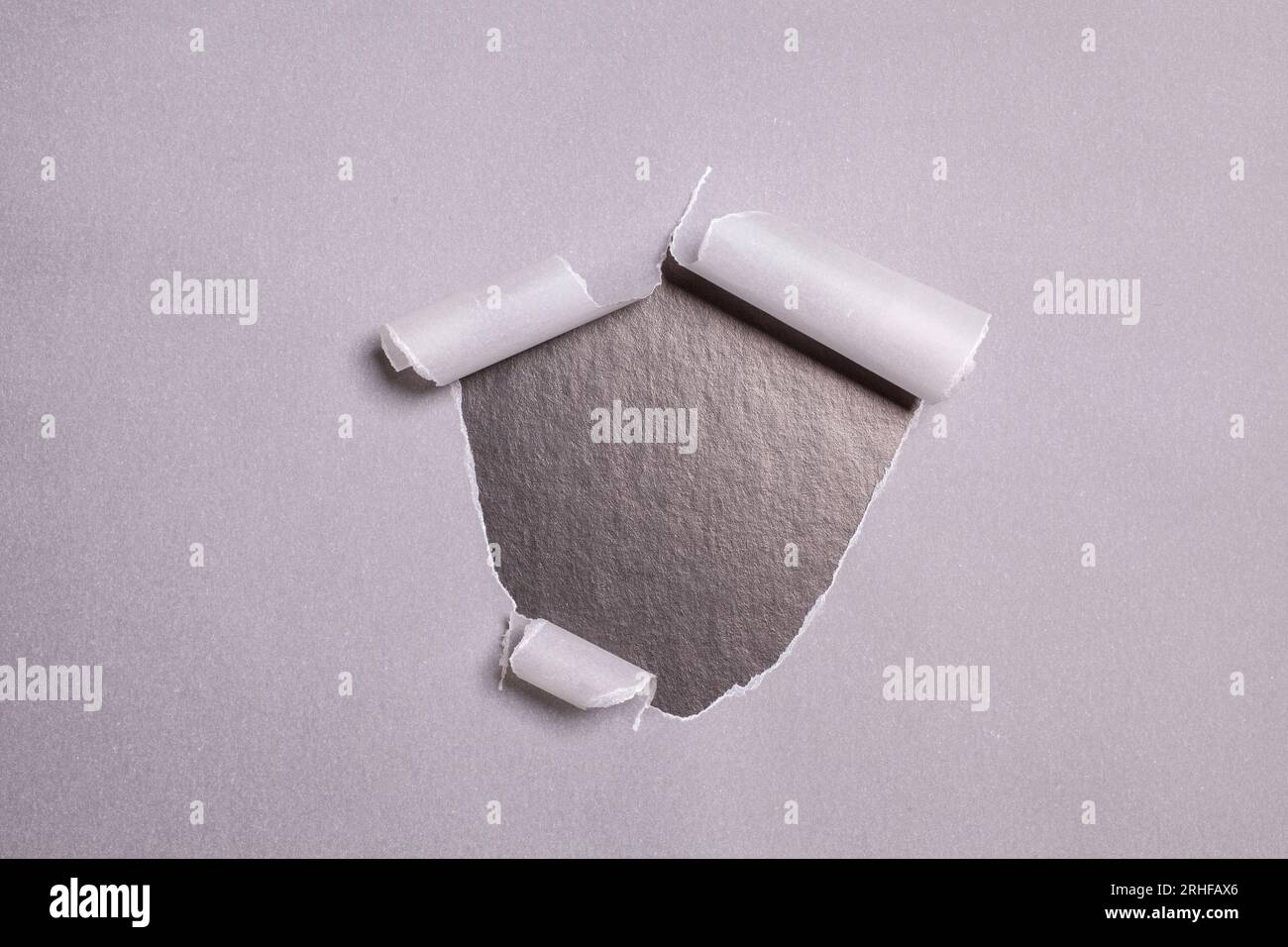 Paper hole with torn sides in paper texture with copy space Stock Photo ...