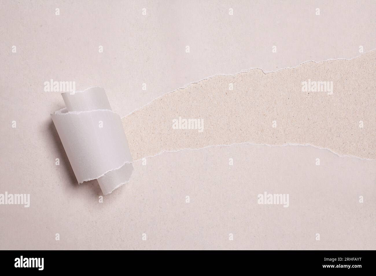 Torn paper with opening showing white background Stock Photo - Alamy