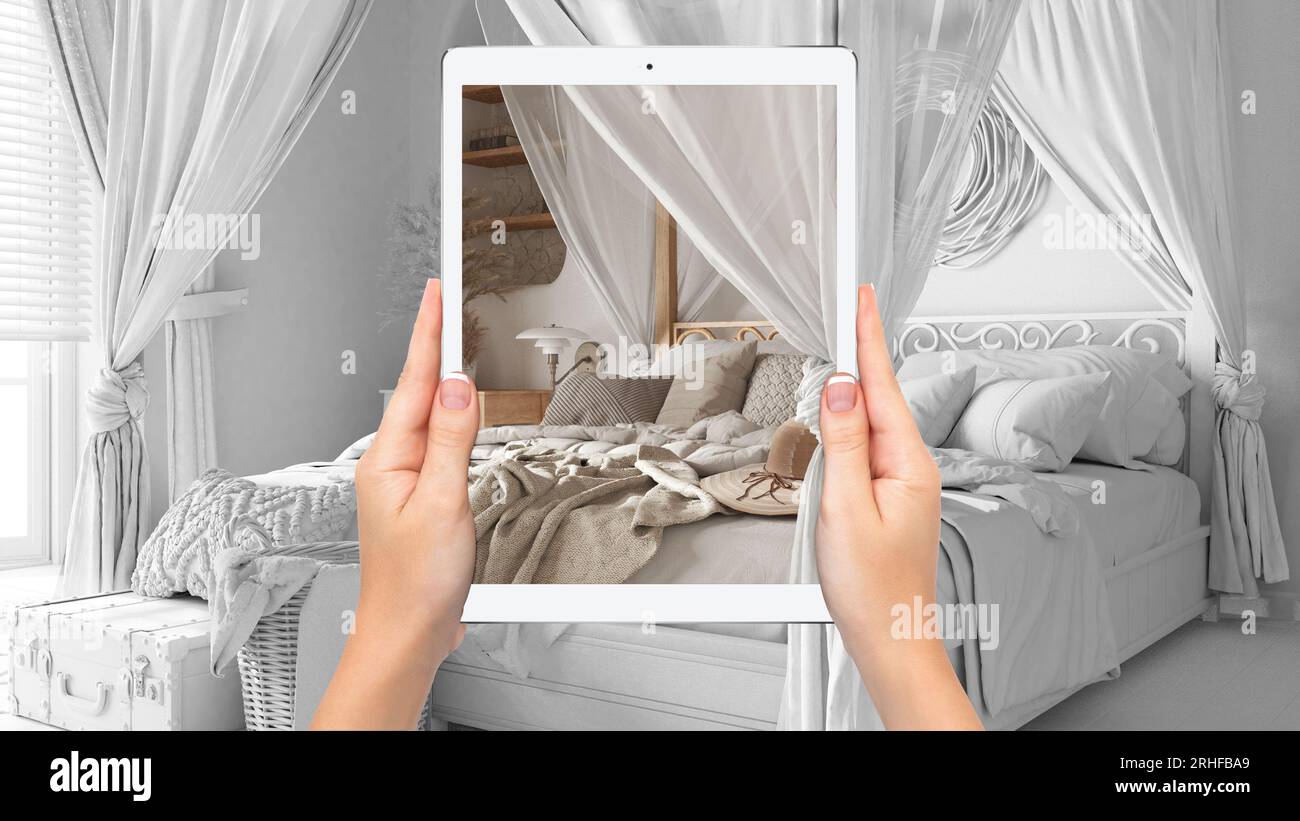 Hands holding tablet showing bohemian bedroom in boho style, total ...