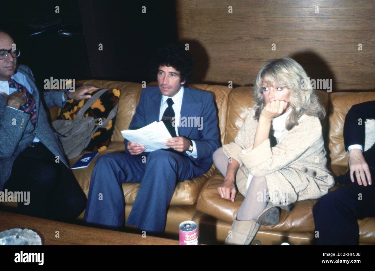 Farrah Fawcett on couch next to President of Faberge, Richard Barrie ...