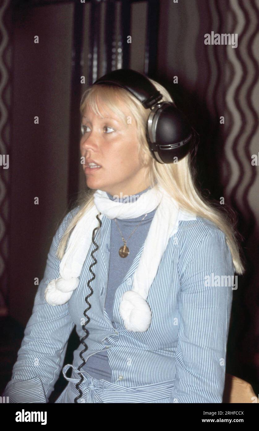 Agnetha Fältskog of ABBA, wearing headphones, singing in recording ...