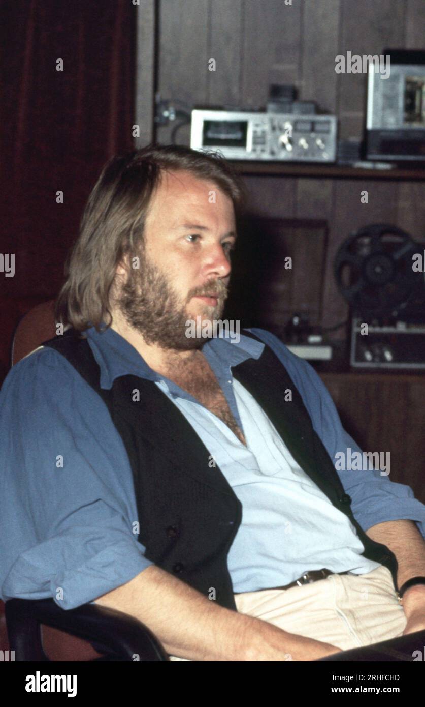 Björn Ulvaeus of ABBA, in side shot sitting in chair in studio, wearing ...