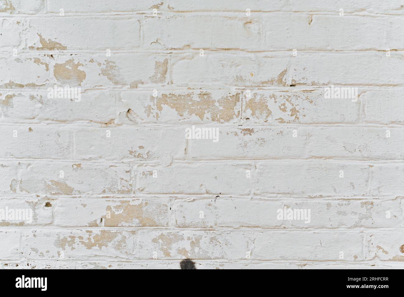 an old white brick wall with peeling paint. Old vintage brick wall ...