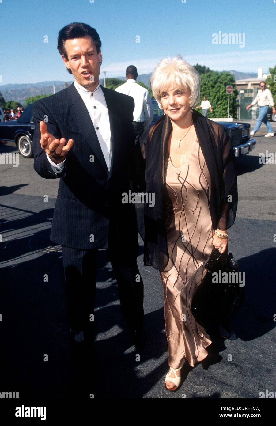 Randy Travis & Mgr/Wife Libby Hatcher Travis at the ACM Awards, 1997. ph: Ron Wolfson / Everett ...
