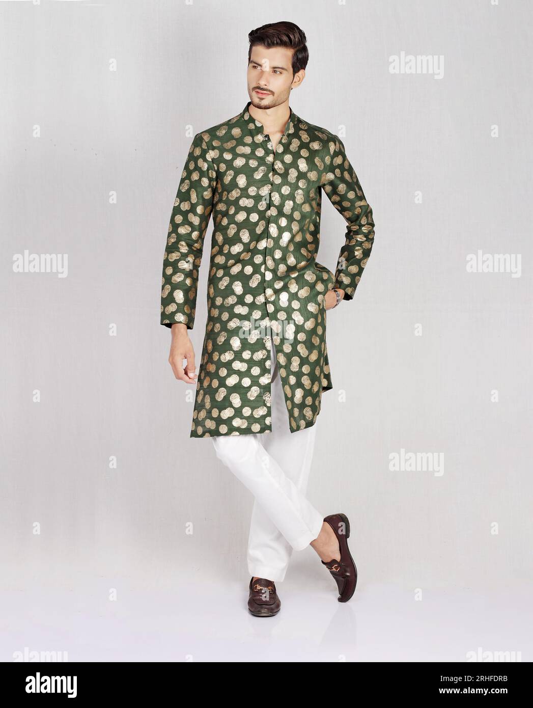 Pakistani male model posing in traditional outfit Stock Photo - Alamy