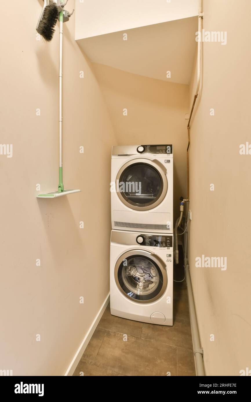 a washer and dryer in a laundry room with the door open to show how it ...