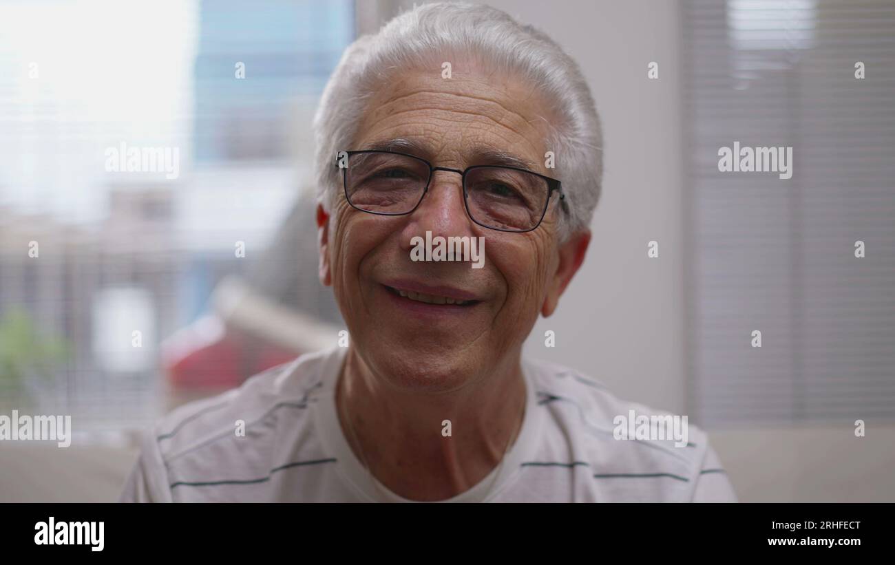 Headshot portrait of Elderly man nodding yes to camera smiling ...