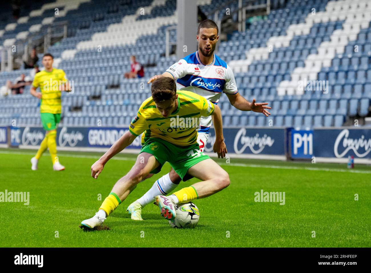 Norwich City's Kellen Fisher (front) battle for the ball with Queens ...