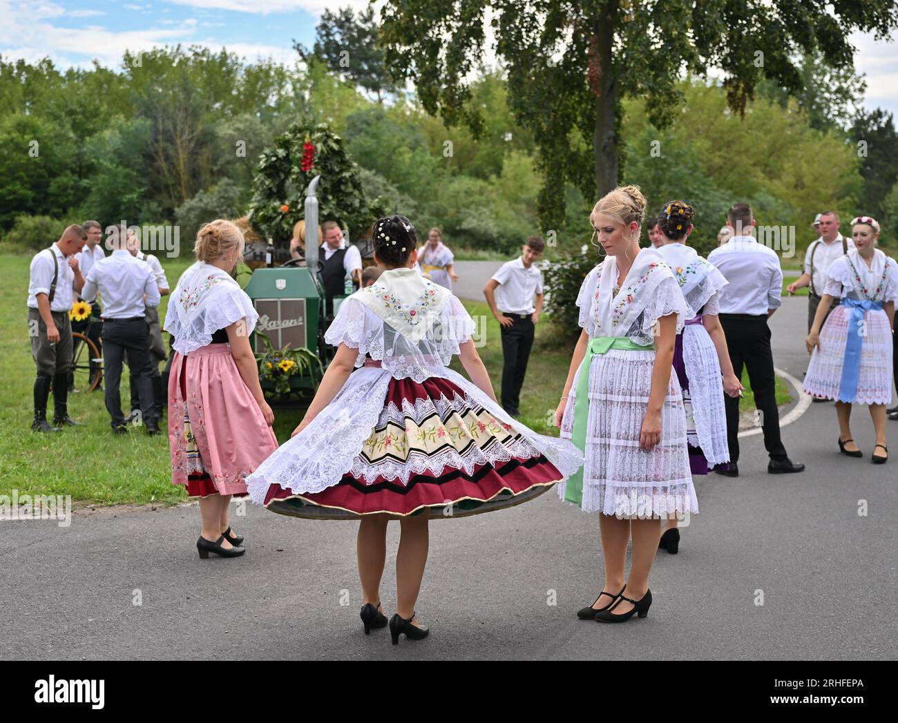 12 August 2023, Brandenburg, Heinersbrück: Young women in Sorbian ...