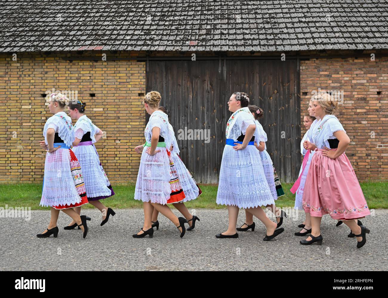 12 August 2023, Brandenburg, Heinersbrück: Young women in Sorbian ...