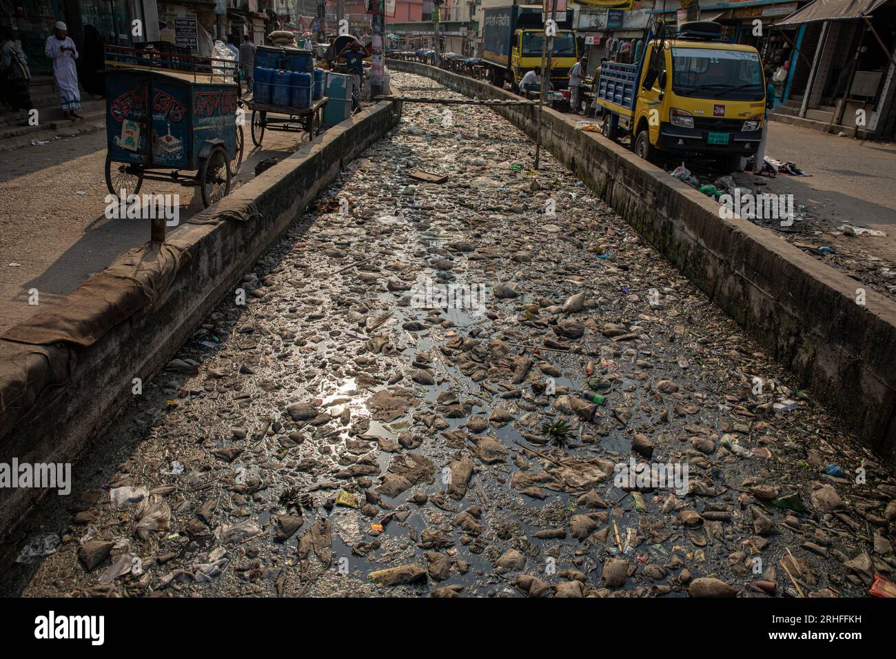 A canal in Dhaka covered with different types of plastic wastes. Dhaka ...