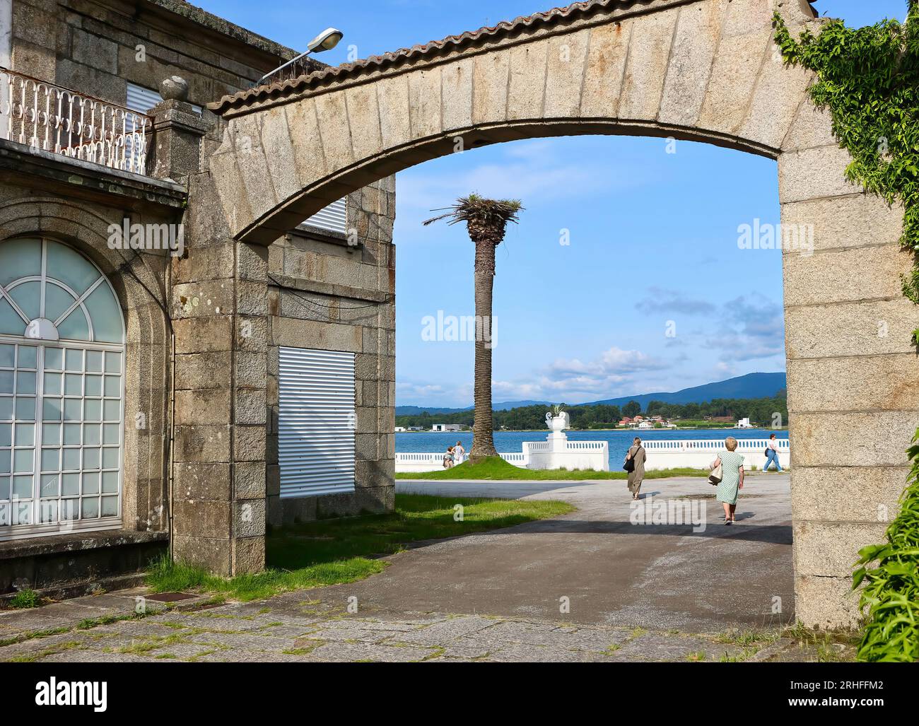 Landscape view through an arch towards the Arousa estuary with a white ...