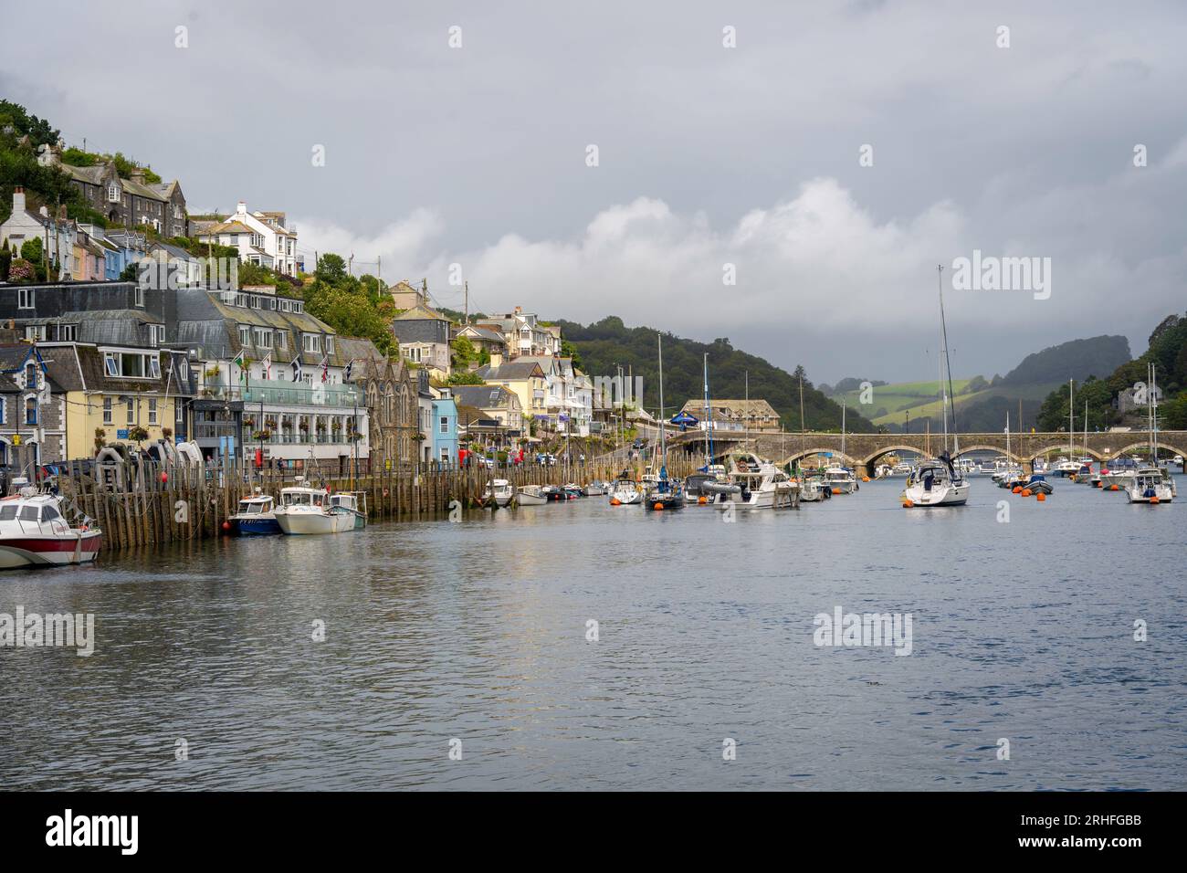 Looe, UK - August 2023: View of harbour and arched bridge over East ...