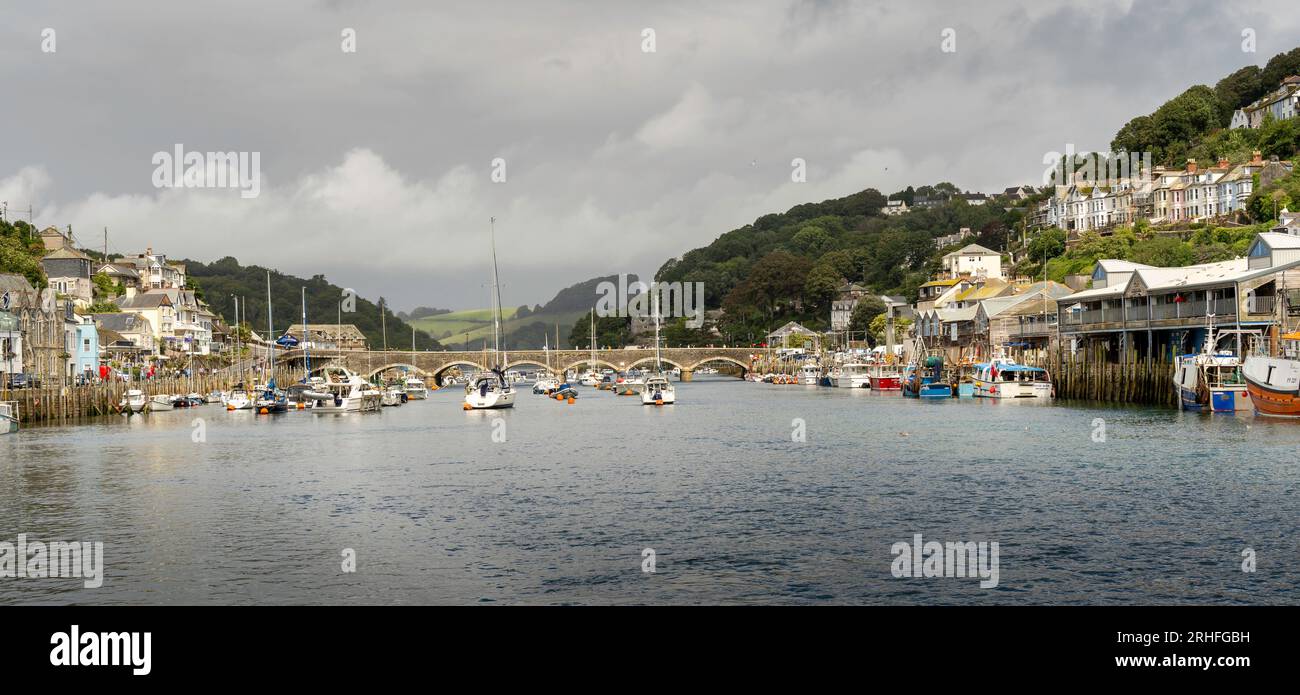 Looe, UK - August 2023: View of harbour and arched bridge over East ...